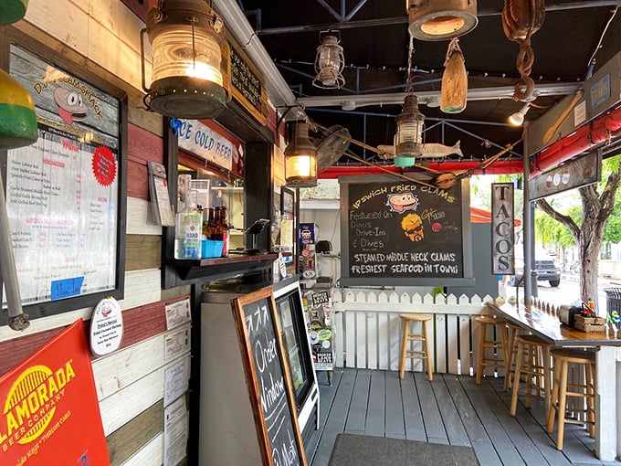 Nautical charm meets seafood perfection in this cozy interior where every lantern, buoy, and weathered board tells a story of maritime deliciousness.