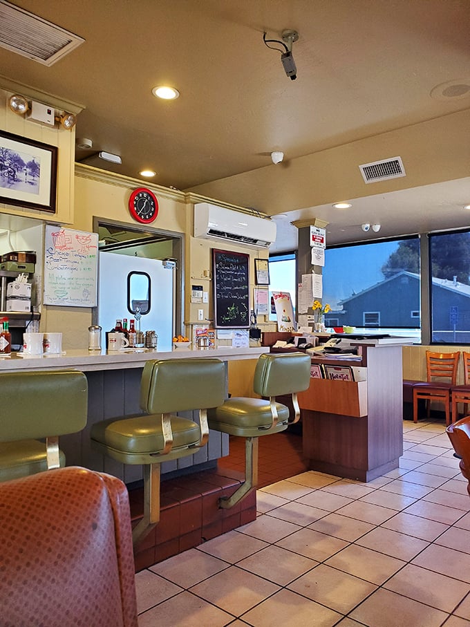 The counter seats offer front-row tickets to the short-order cooking show. Those mint-green stools have supported hungry patrons since Truman was president.