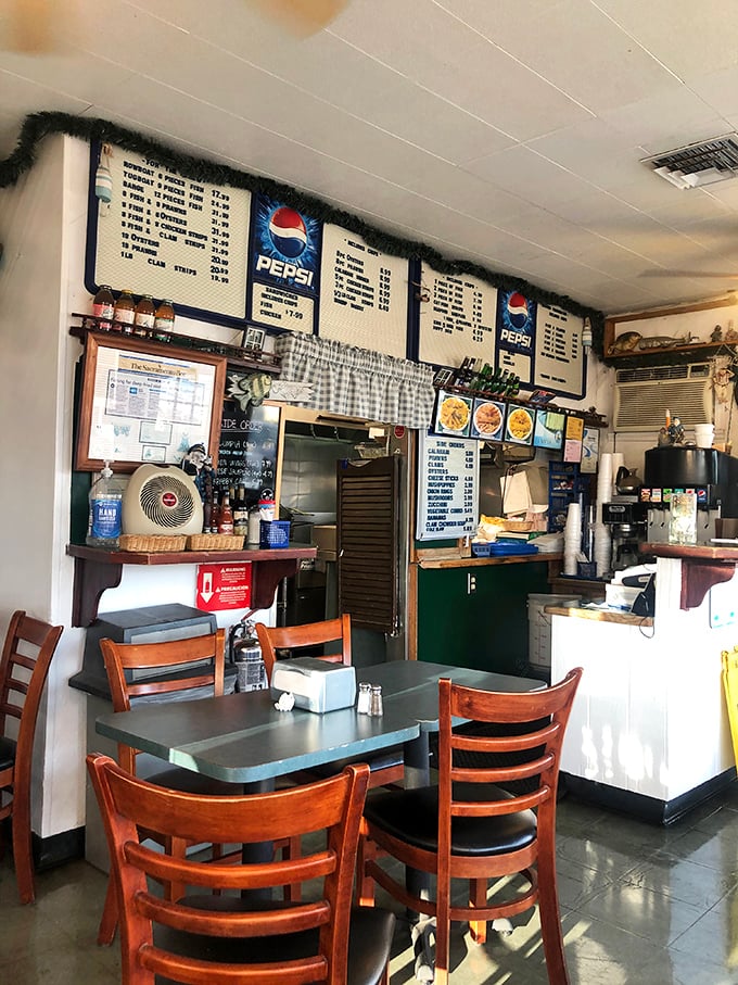 Simple wooden chairs, no-nonsense menu boards, and that unmistakable aroma of perfectly fried seafood. This is where memories are made, one crispy bite at a time.