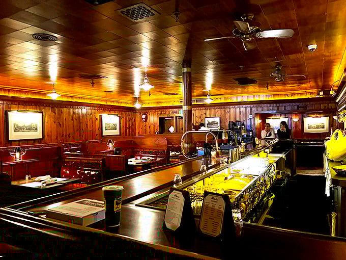 Step inside and time stands still. The warm wood paneling and amber lighting create the kind of atmosphere where important decisions—like "medium-rare or rare?"—are made.