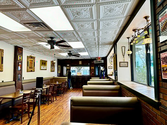Those ornate tin ceiling tiles aren't just decoration—they're witnessing decades of delicious conversations happening beneath them.