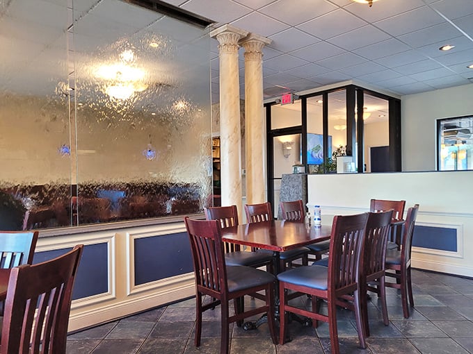 Classical columns meet modern dining in this thoughtfully designed space. The water feature's gentle shimmer creates an atmosphere that's both elegant and relaxed.