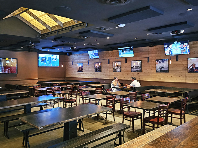 Inside Bludso's, wooden tables beneath skylights create the perfect setting for barbecue communion—casual, comfortable, and ready for serious eating.