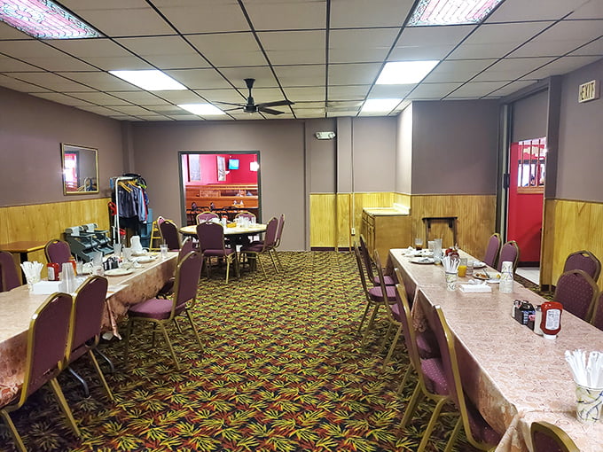 Classic diner charm with wood paneling and patterned carpet that screams "comfort food ahead." This isn't Instagram-bait décor—it's the real deal.
