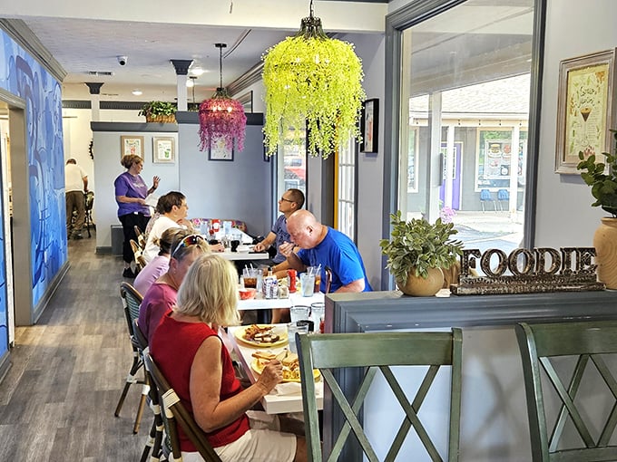 Colorful chandeliers and that "FOODIE" sign say it all – this isn't just eating, it's an experience. The cheerful interior promises good things for your taste buds.
