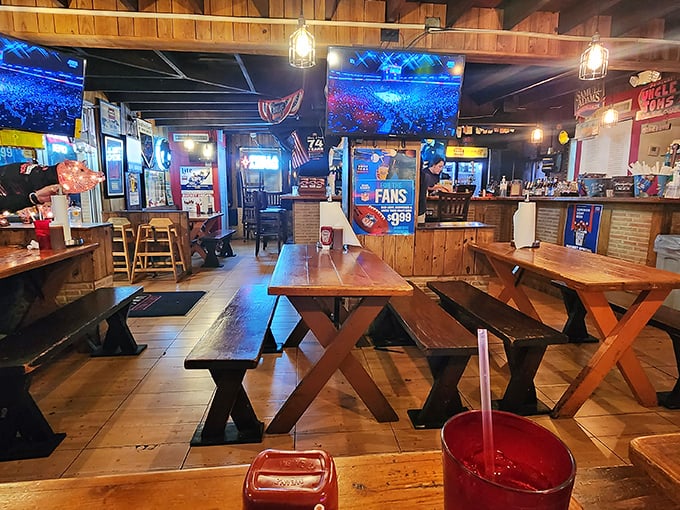 Rustic wooden tables and benches create the perfect backdrop for barbecue communion. This isn't fine dining—it's something better: honest food in an honest setting.