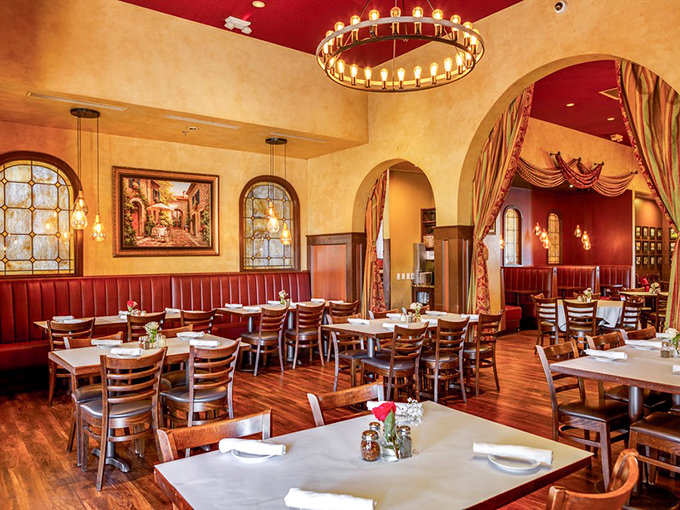 Step inside and you're transported to Italy without the jet lag—warm amber walls, rich wood, and that magnificent chandelier creating the perfect ambiance for carb-loading.