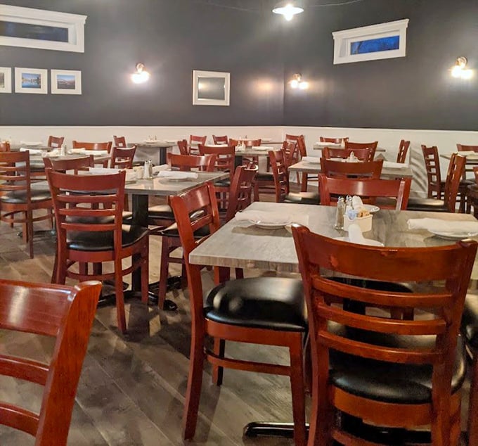 No pretentious frills here—just comfortable wooden chairs and navy walls that let the seafood be the star. This dining room says "focus on your plate, not the decor."