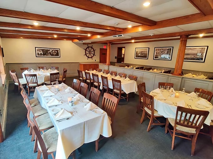 White tablecloths meet wooden beams in this dining room where nautical touches remind you that seafood reigns supreme here.