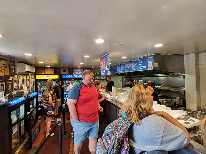 Inside, the no-nonsense interior buzzes with anticipation. This isn't about ambiance—it's about the serious business of sandwich perfection.