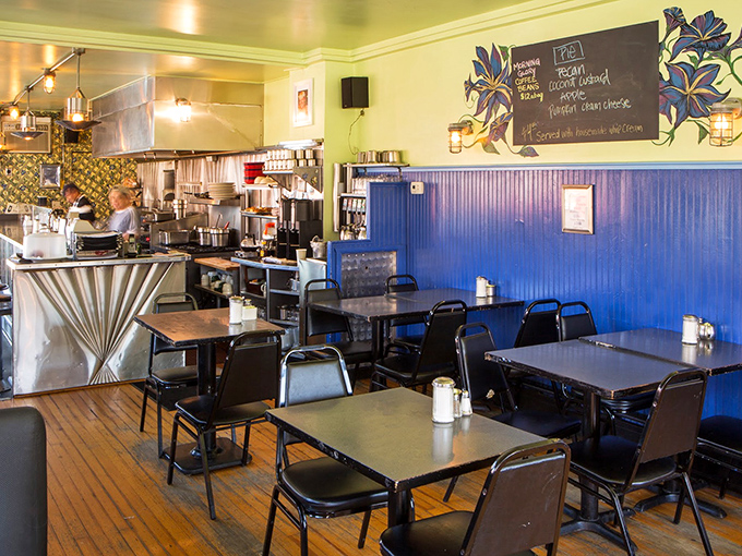 Step inside and feel instantly at home – yellow walls and blue accents create the perfect breakfast backdrop.