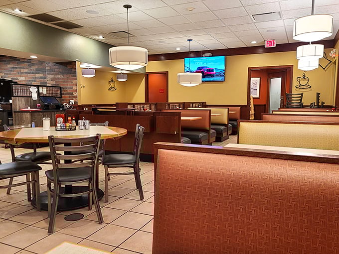 Cozy booths and warm lighting create that perfect diner atmosphere where breakfast dreams come true and coffee cups never stay empty.