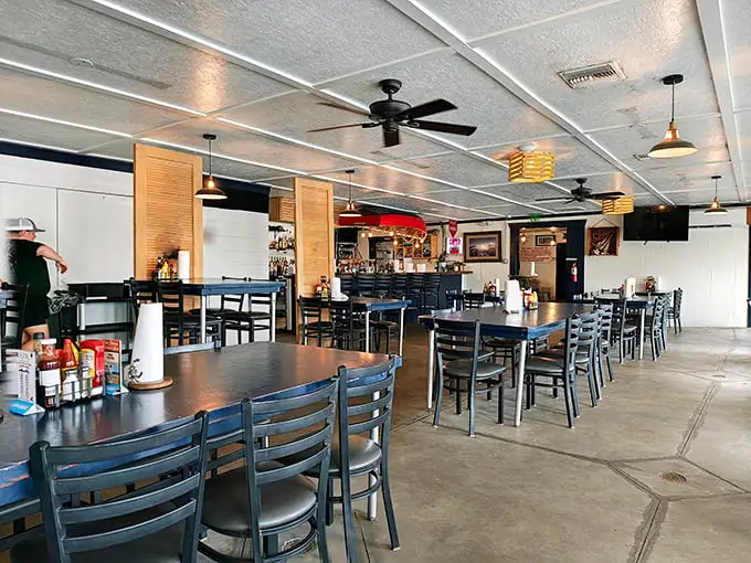 Inside, ceiling fans lazily spin above simple tables where seafood dreams come true. This isn't Instagram-bait décor—it's the authentic stage for some serious Gulf Coast magic.