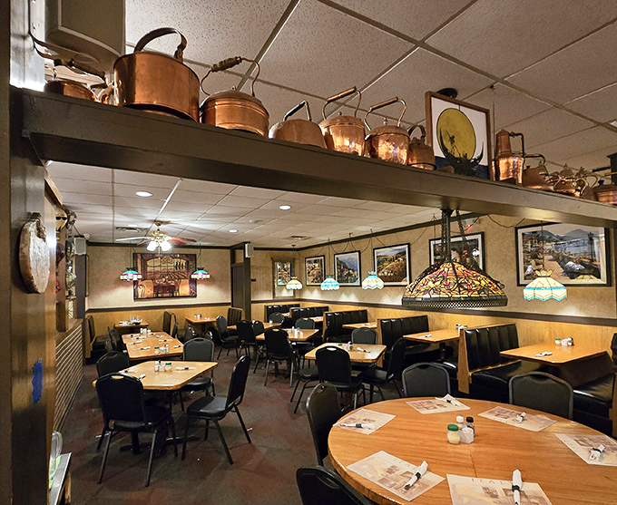 Copper pots gleaming overhead like culinary constellations, Tiffany lamps casting a warm glow—this isn't decoration, it's a time machine to Nonna's kitchen.