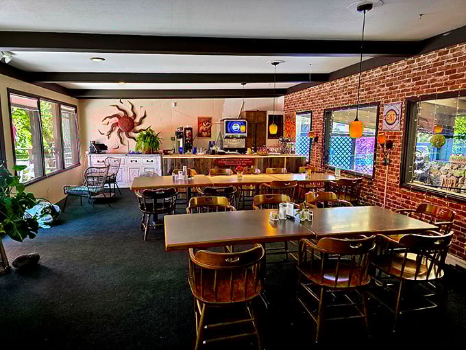 Exposed brick meets wooden captain's chairs in Mac's dining room, where conversations flow as freely as the coffee. Comfort never went out of style here.