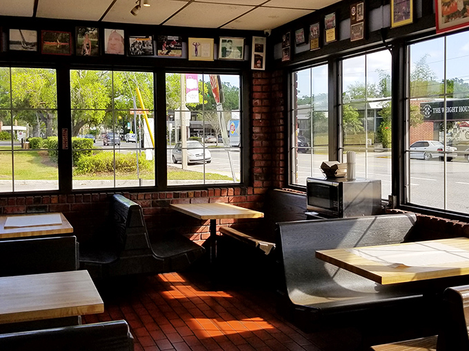 Sunlight streams through large windows, illuminating a dining room where memories are served alongside legendary subs.