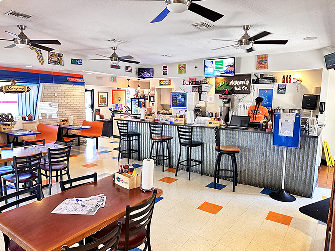 Inside, the checkered floor and corrugated metal counter create that perfect "focus-on-the-food" atmosphere where napkins aren't optional—they're essential tools of the trade.