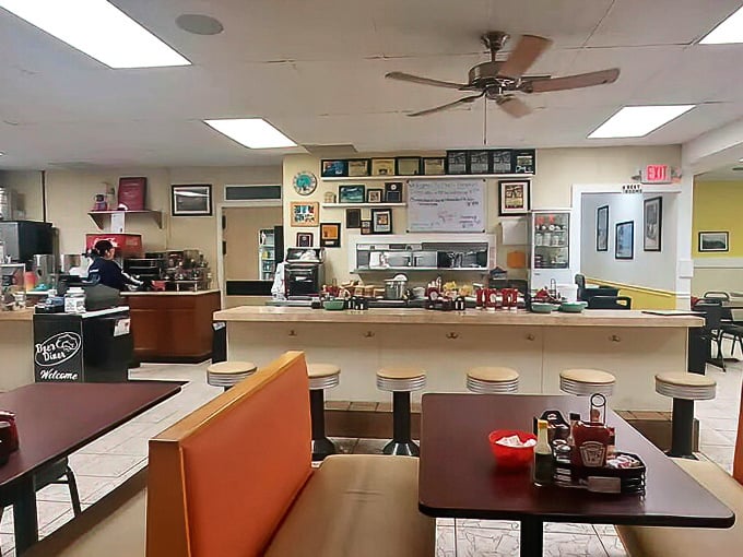 Classic diner counter seating where breakfast dreams come true and coffee cups are never empty. The ceiling fans keep the Keys breeze flowing indoors.