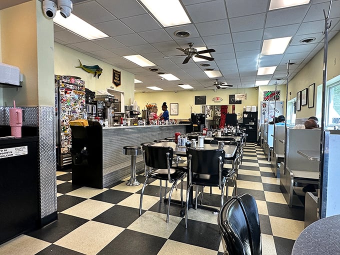Classic black and white checkered floors, chrome accents, and counter seating—this is diner perfection where breakfast dreams come true.