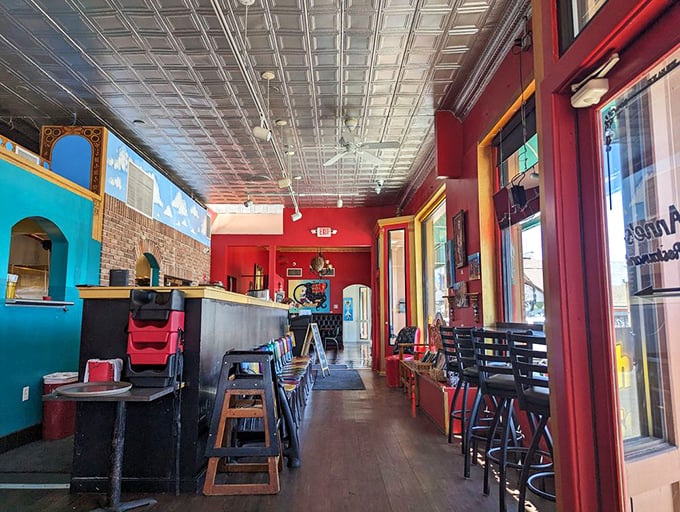 Step inside where vibrant red walls and tin ceilings create the perfect backdrop for serious Mexican food. 