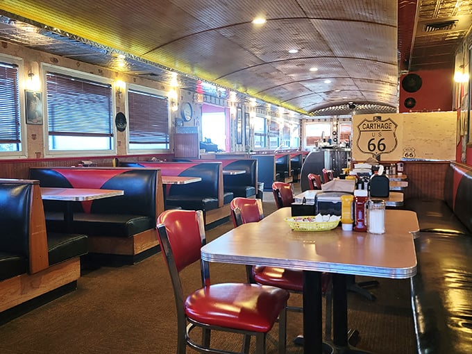 Step inside and you're transported to the golden age of diners—red vinyl booths, curved ceiling, and Route 66 memorabilia create the perfect backdrop for comfort food bliss.
