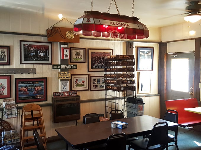Alabama football memorabilia adorns the walls in Tennessee territory—a bold move forgiven only because the barbecue speaks a universal language everyone understands.