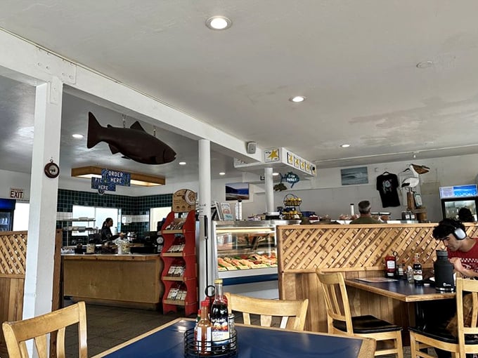 Wooden lattice, nautical decor, and that watchful fish overhead – this isn't Instagram bait, it's the real McCoy of seafood joints that existed long before selfies.