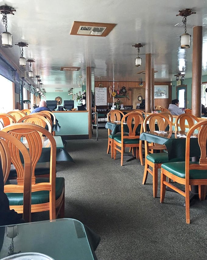 Inside, honey-colored wood and seafoam green accents create the kind of nautical vibe that doesn't need to shout "we're near the ocean!"—because you can see it.