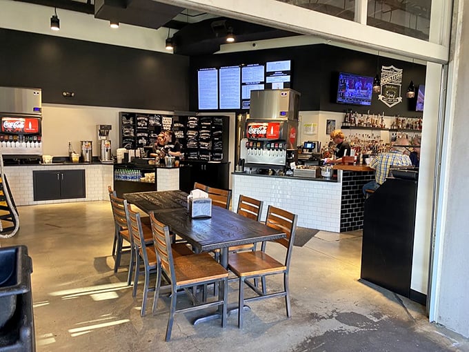 The interior strikes that perfect balance between "serious about barbecue" and "come as you are" – industrial chic meets Southern hospitality.