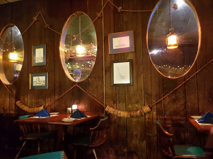 Step inside and you're transported to a maritime wonderland, where porthole mirrors and wooden walls create the perfect nautical time capsule for your dining adventure.