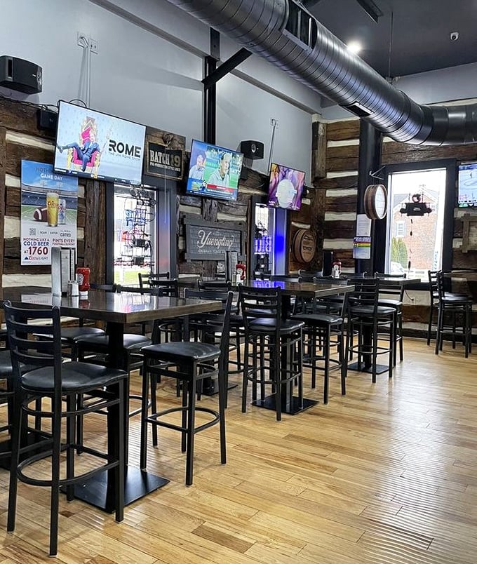Industrial meets cozy in this modern pub setting. The exposed ductwork and wooden accents create that perfect "come as you are, stay for hours" vibe.