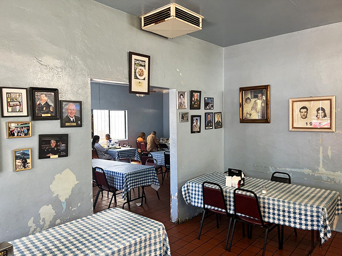 Blue checkered tablecloths and walls adorned with decades of memories. This dining room isn't designed for Instagram—it's designed for eating seriously good food.