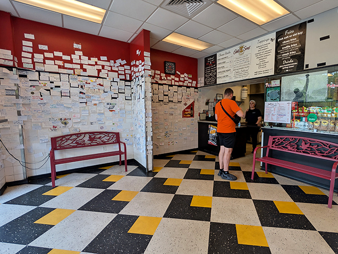 That iconic red and white wall of customer testimonials speaks volumes – this isn't just decoration, it's a community-built shrine to sandwich perfection.