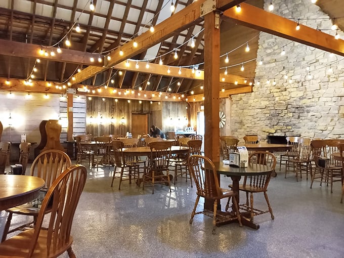Exposed wooden beams, stone walls, and twinkling string lights create that perfect "rustic elegance" atmosphere—farmhouse chic that feels both special and comfortable.