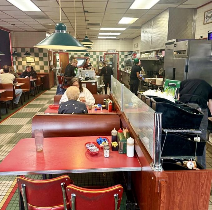 Classic green and white checkered floors, red vinyl booths, and counter seating—this isn't retro by design, it's authentic by survival.
