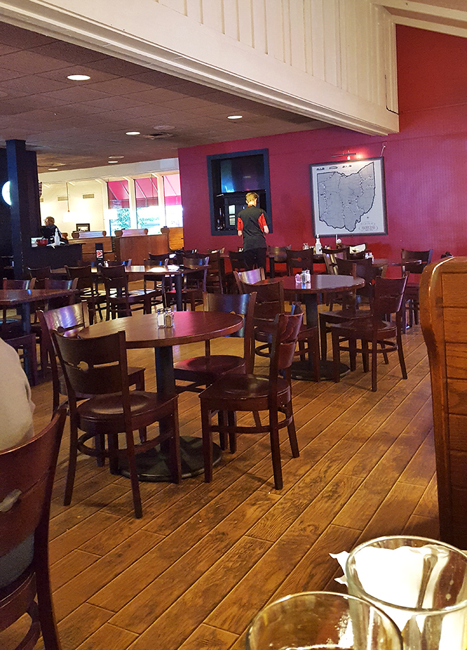 Inside, warm wooden floors meet bold red walls, creating that perfect "fancy but not fussy" atmosphere where both date nights and family dinners thrive.