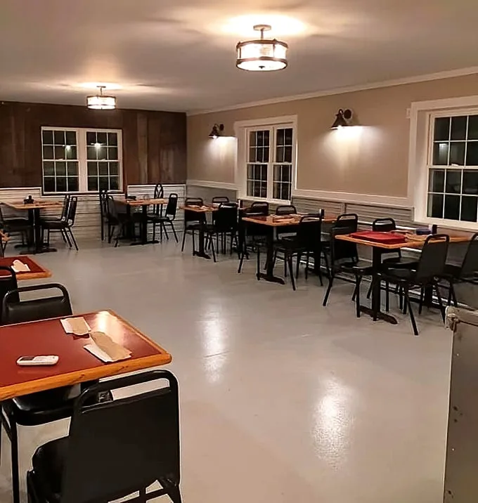Simple wooden tables and warm lighting create the perfect backdrop for serious eating. No distractions here, just an environment designed for food appreciation.