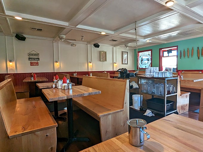 Wooden booths worn to perfection by decades of happy diners. That turquoise accent wall isn't just pretty—it's practically announcing "memorable meal ahead!"