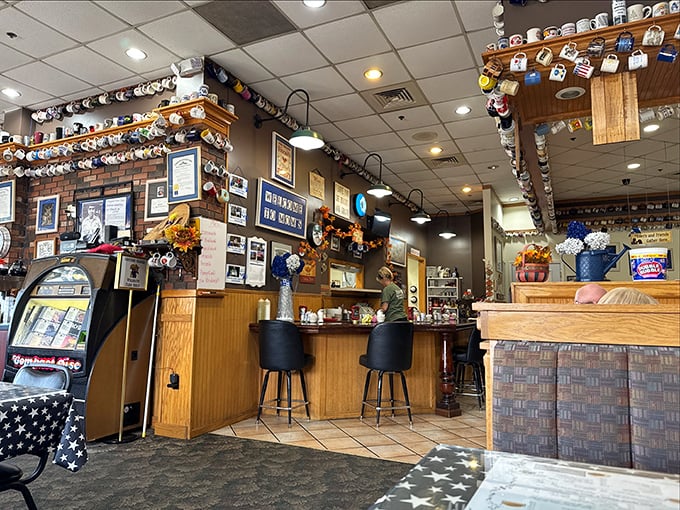 Coffee mugs from around the world create a cozy museum of satisfied customers.