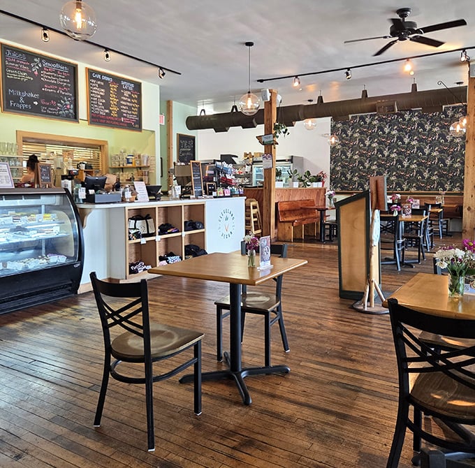 Warm wooden floors, globe pendant lights, and chalkboard menus create the kind of cozy atmosphere that makes you want to linger over that second cup of coffee.