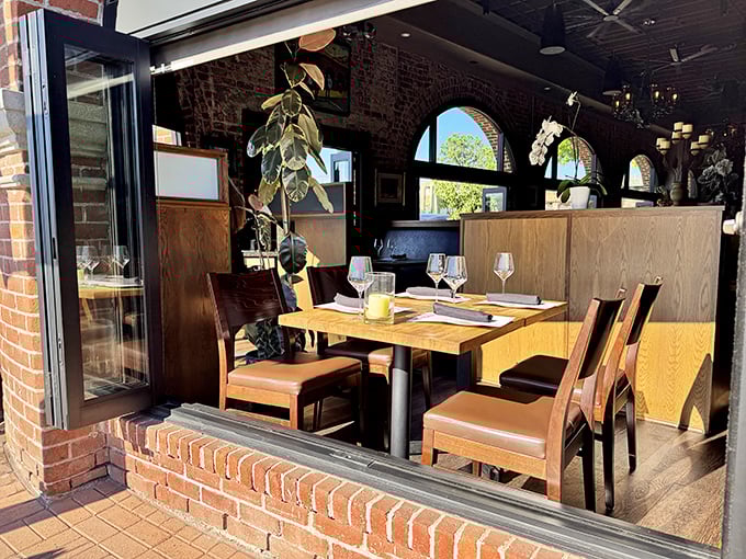 Rustic elegance meets barbecue haven. The dining room's exposed brick and arched windows create an atmosphere that's both refined and ready for serious eating.
