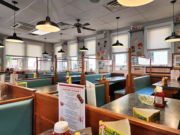 Classic teal booths and wooden dividers create that perfect "come as you are" atmosphere where comfort food tastes even better.