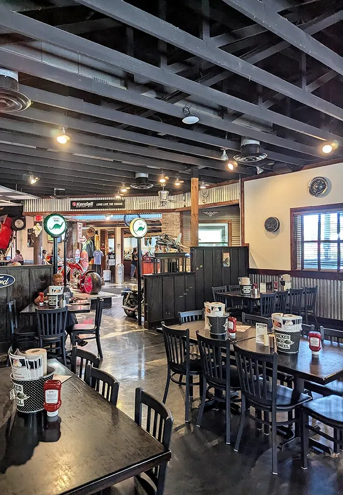Industrial-chic meets biker bar in this surprisingly cozy interior. The exposed beams and motorcycle decor create an atmosphere that's both edgy and welcoming.
