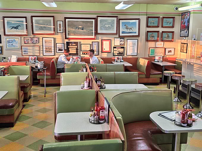 Mint-green booths and horse racing prints create the perfect backdrop for breakfast conversations that feel like they're happening in 1965.