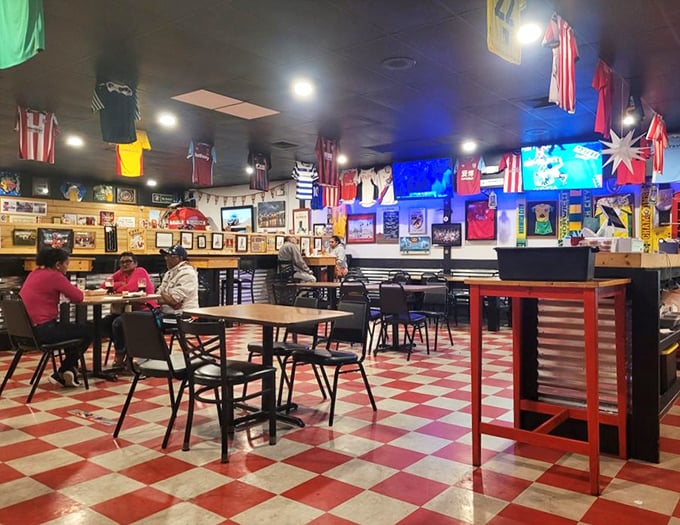 Step inside and you're transported across the pond—soccer jerseys, checkered floors, and all the charm of a proper British chippy.
