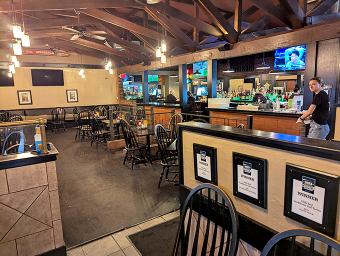 Exposed wooden beams and warm lighting transform what was once a place of confinement into a haven of comfort and exceptional dining.