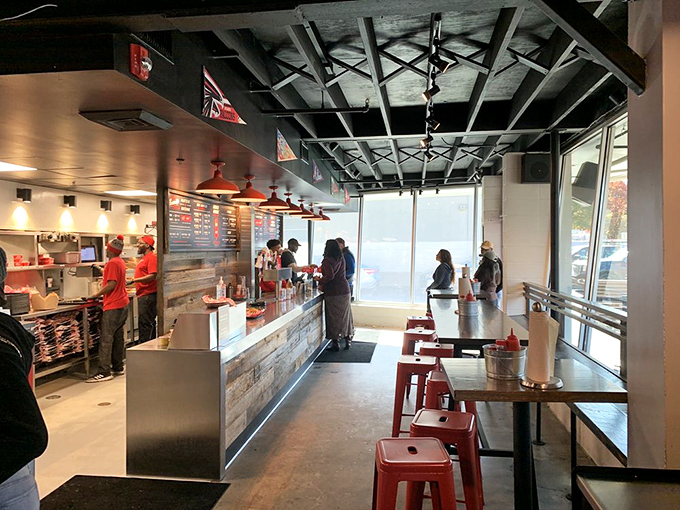 Industrial-chic meets Southern hospitality inside, where exposed ceiling beams watch over hungry patrons lining up for their spicy salvation.