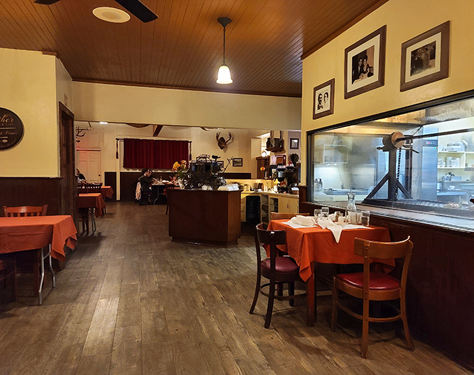 Step inside and you're transported to a simpler time—wooden paneling, red tablecloths, and the promise of oak-fired perfection.