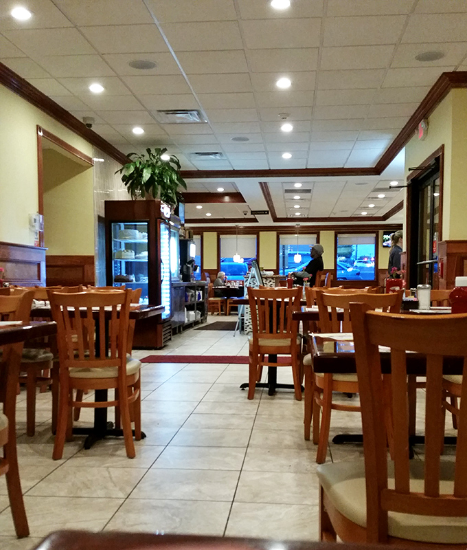 Classic diner elegance with warm wood tones and comfortable seating. The kind of place where "just coffee" turns into a three-hour conversation.