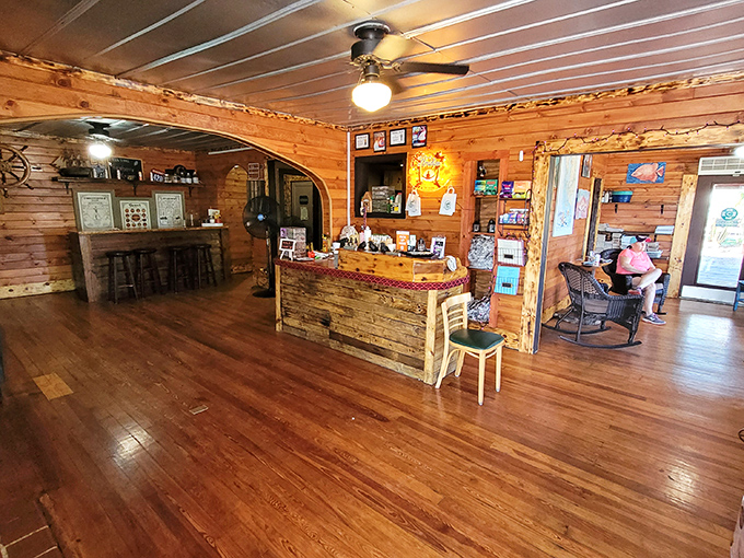 Where wooden planks tell stories and ceiling fans keep seafood secrets. The rustic interior feels like stepping into a fisherman's living room—one that happens to serve incredible food.